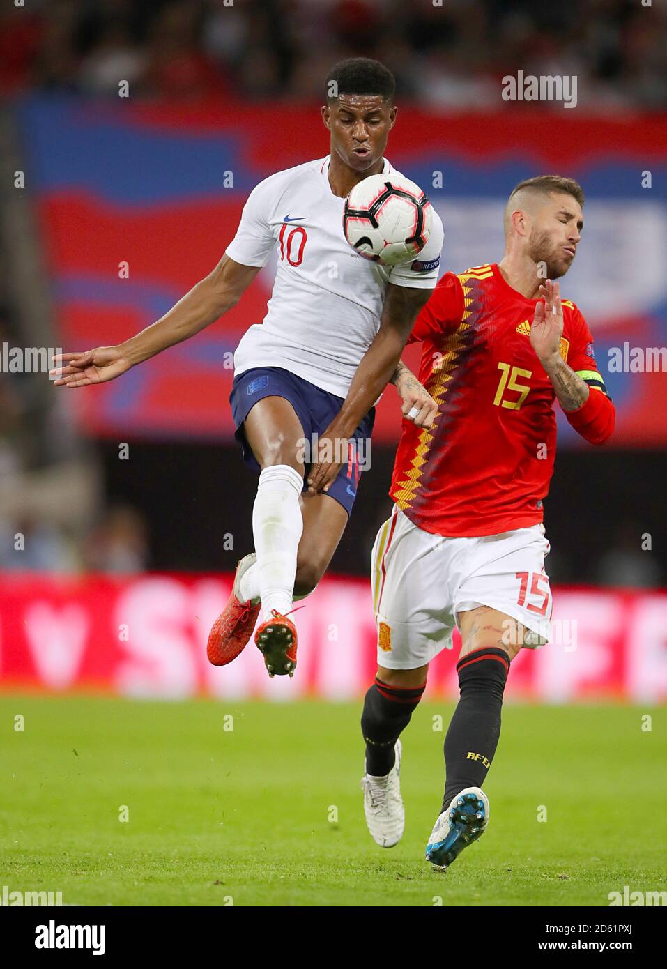 England's Marcus Rashford (left) and Spain's Sergio Ramos battle for ...