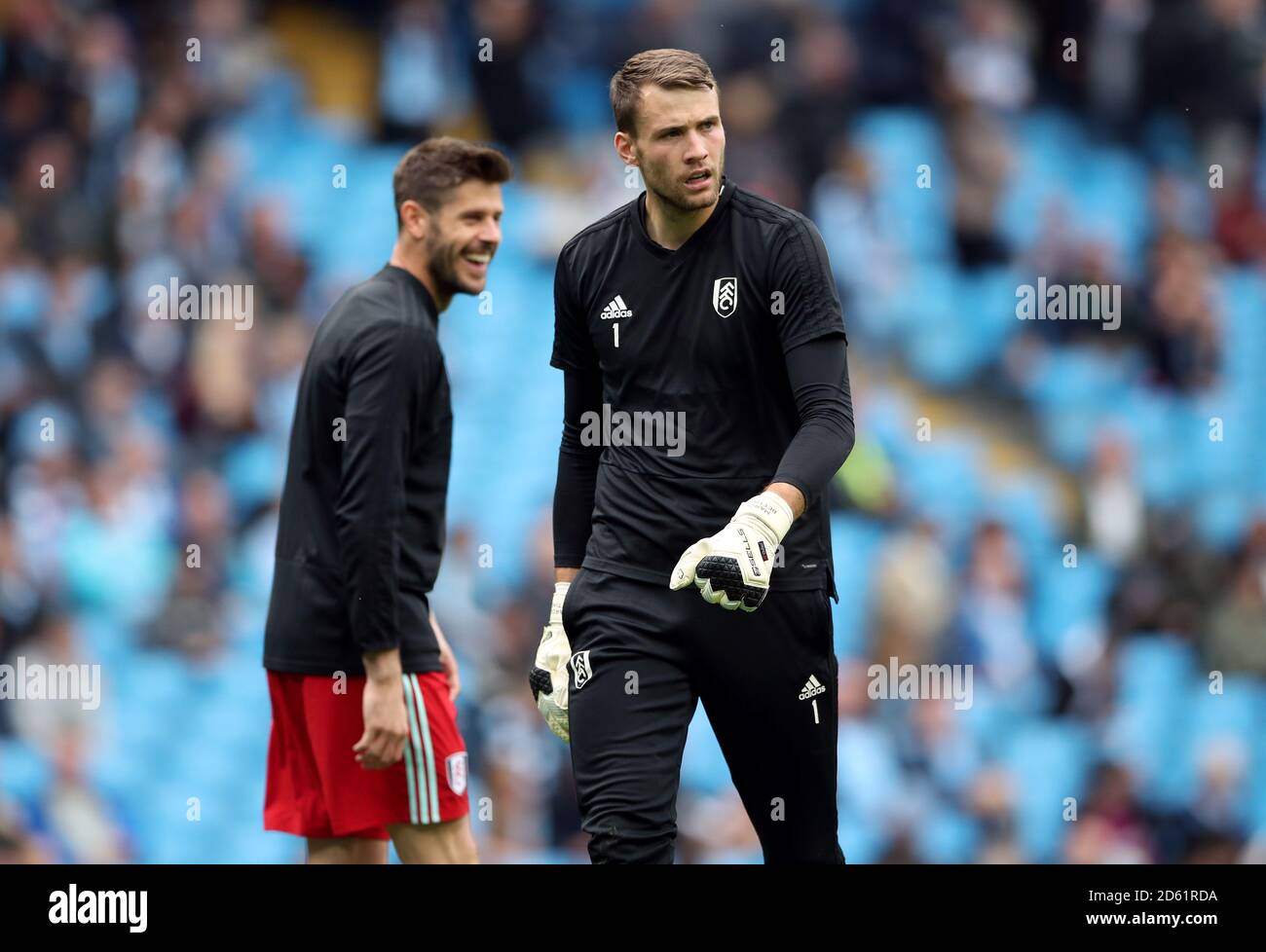 Fulham goalkeepers Marcus Bettinelli (right) and Fabri warm up before ...
