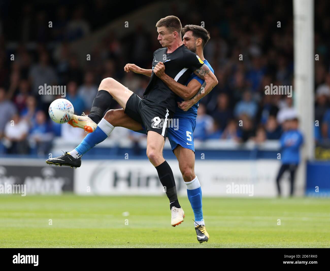 Peterborough United's Ryan Tafazolli (right) and Portsmouth's Oli ...