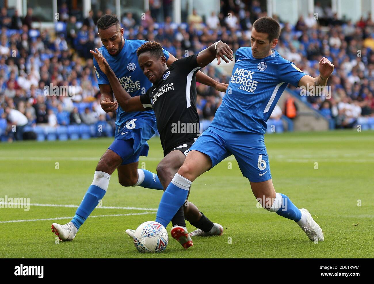 Peterborough United's Jamie Walker and Portsmouth's Jamal Lowe during ...