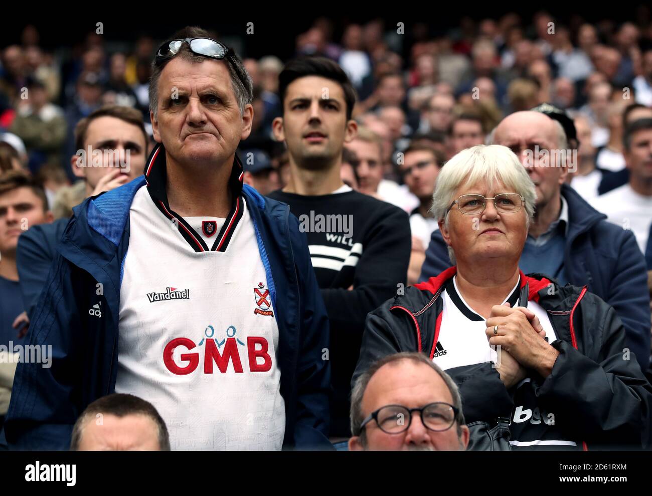 Fulham fans in the stands Stock Photo - Alamy
