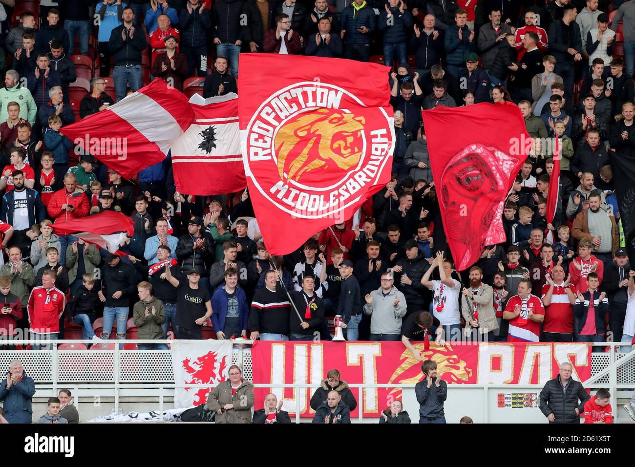 Middlesbrough fans waving flags in the stands Stock Photo - Alamy