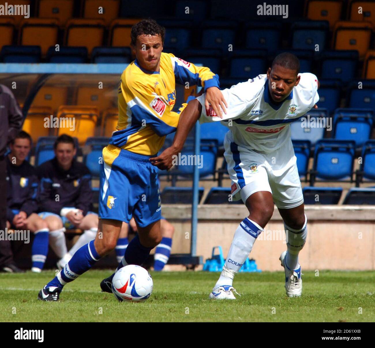 Mansfield Town's Gareth Jellyman and Stockport County's Tesfaye Bramble ...