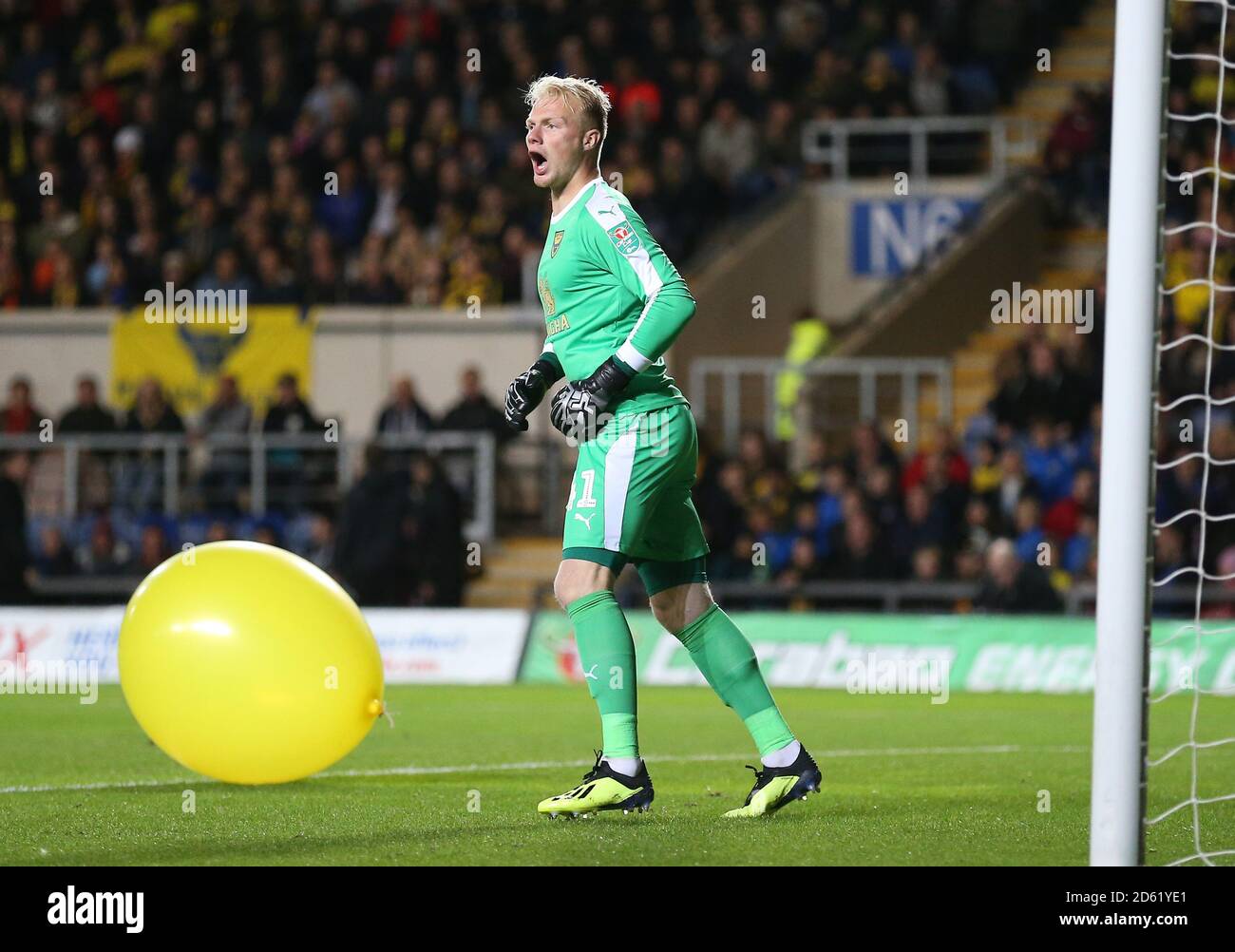 A large balloon drifts in front of Oxford United's goalkeeper Jonathan ...
