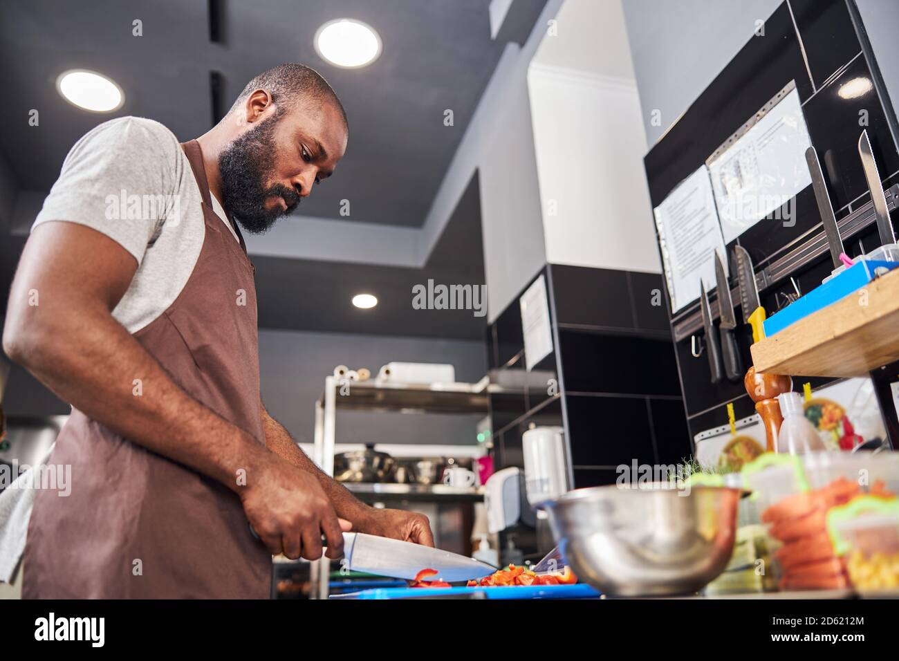 Young Afro American chef cooking in professional kitchen Stock Photo ...