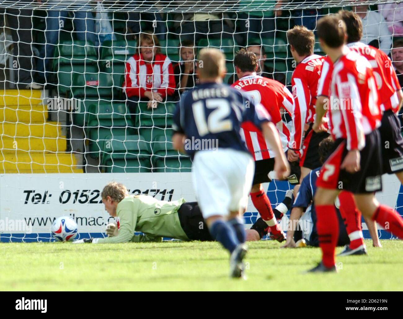 Lincoln City's goalkeeper Alan Marriott is unable to keep the ball out ...