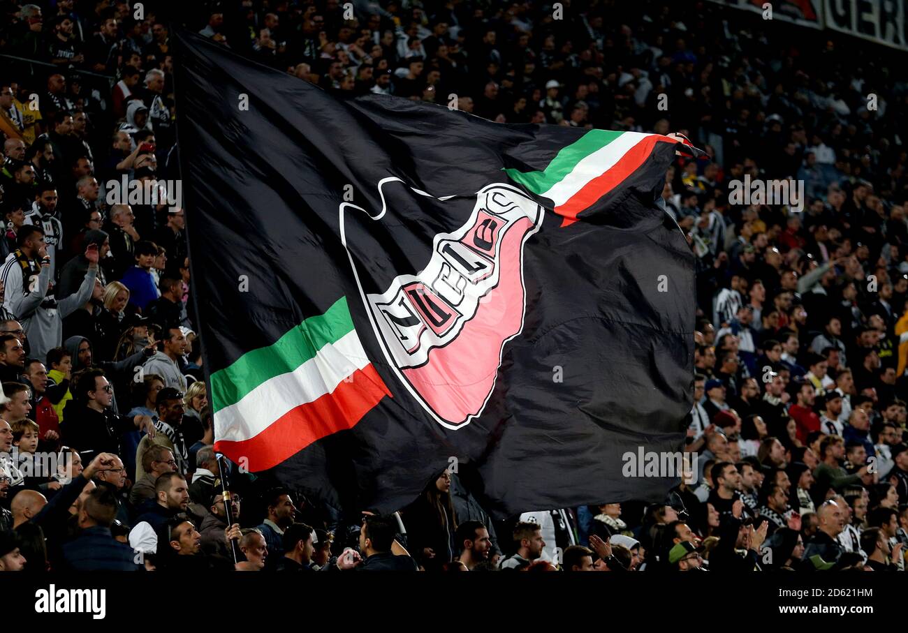 Juventus fans with a giant flag in the stands Stock Photo - Alamy
