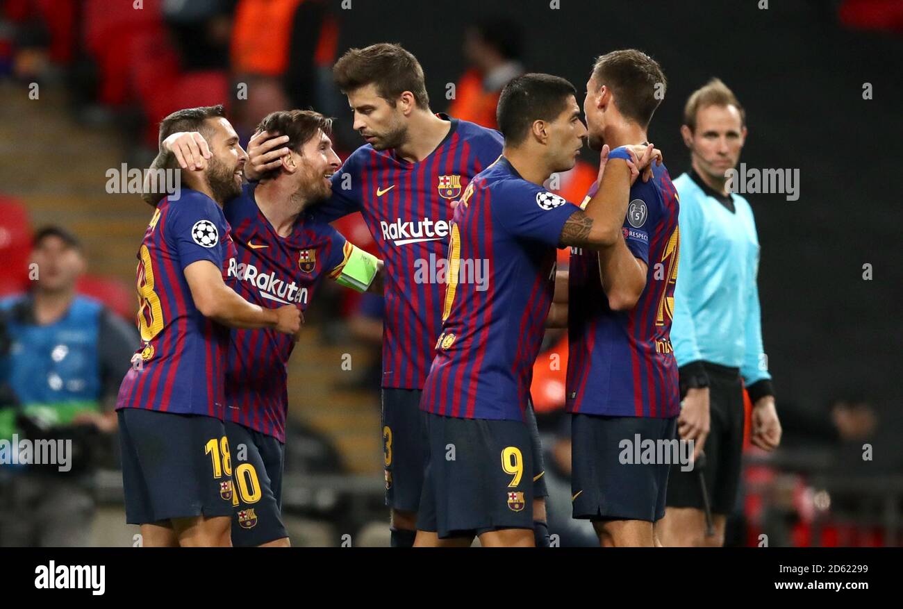 Barcelona's Lionel Messi (second left) celebrates scoring his side's ...