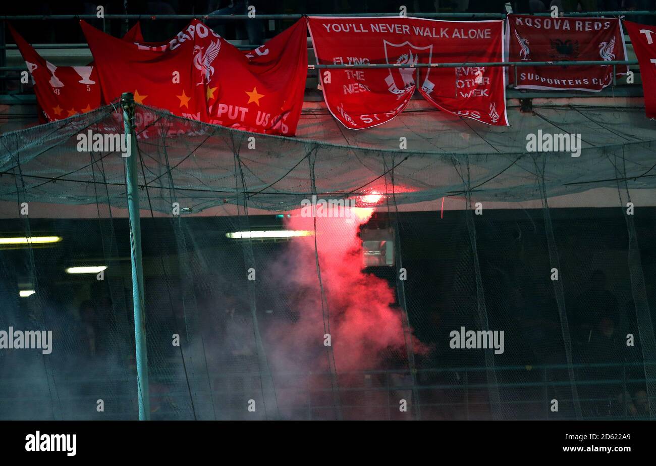 Liverpool fans light flares in the stands during the match Stock Photo ...