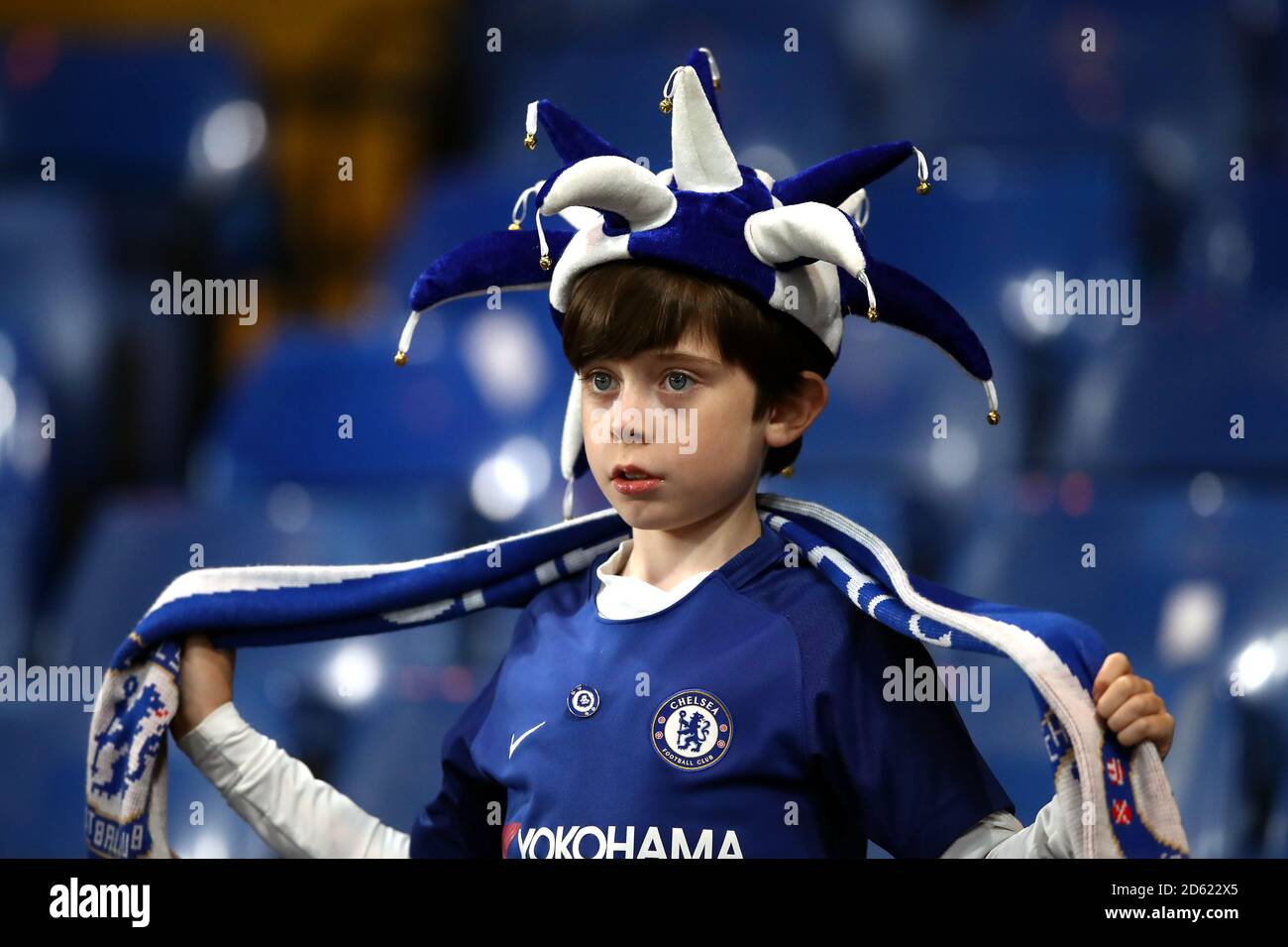 A young Chelsea fan shows his support in the stands prior to the match ...