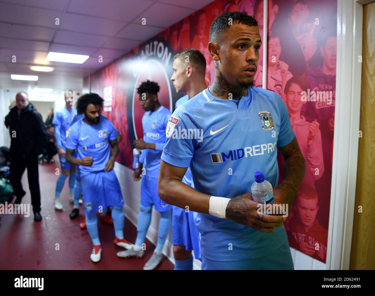 Coventry City's Jonson Clarke-Harris lines up with his team-mates in ...