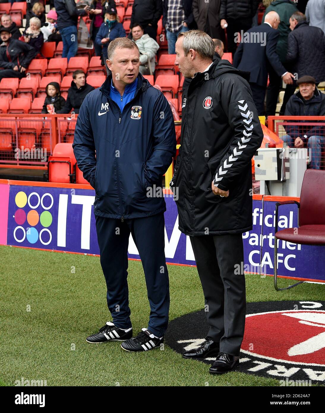 Coventry City manager Mark Robins (left) and Charlton Athletic manager ...