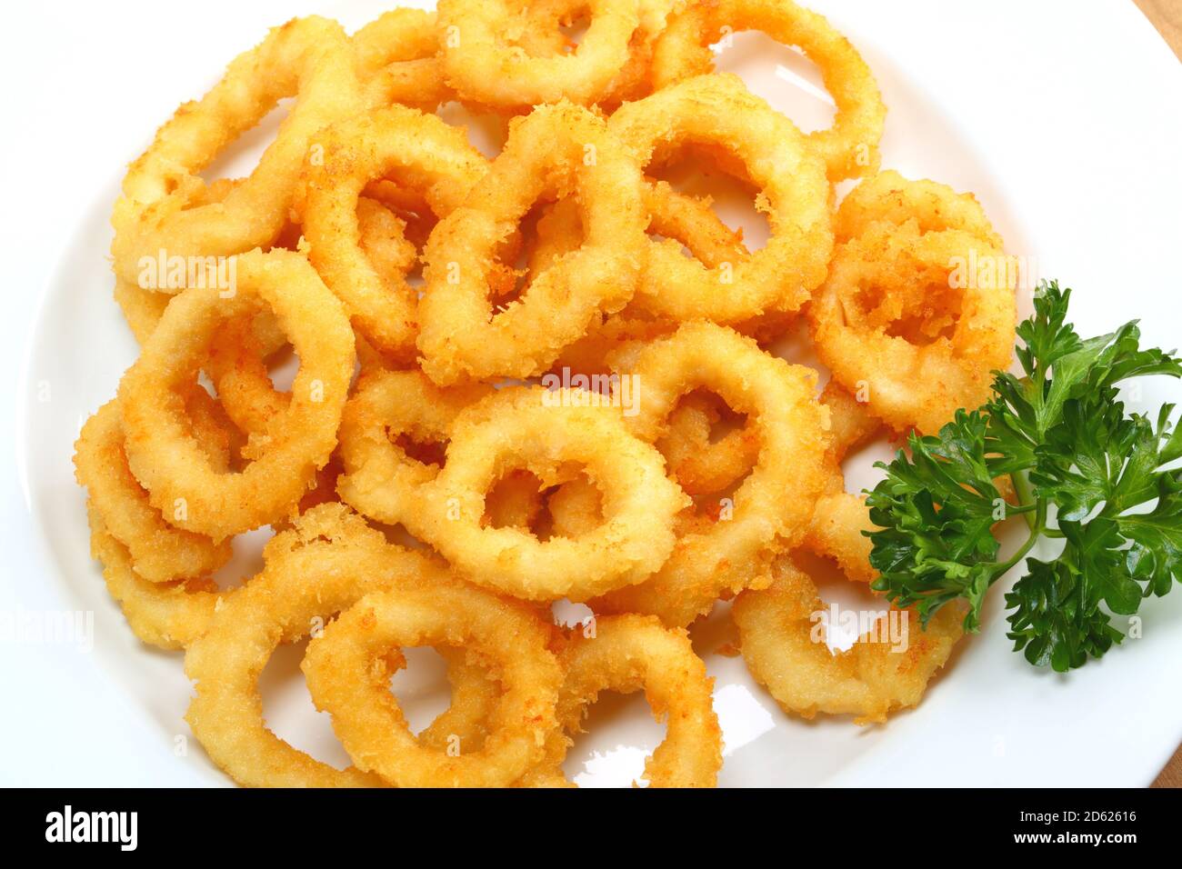 Crispy Calamari Rings on a White Plate Stock Photo - Alamy