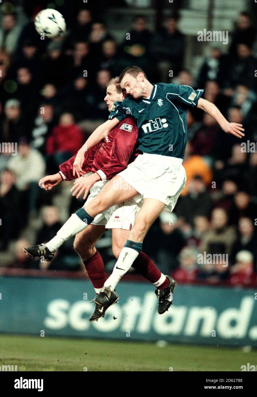 Rangers' Scot Wilson battles for the ball in the air with Hearts ...