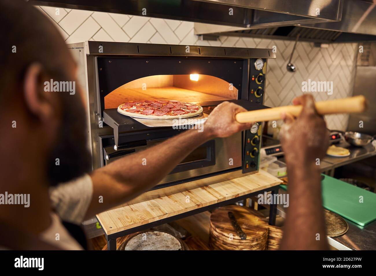 Happy chef making pizza hi-res stock photography and images - Alamy