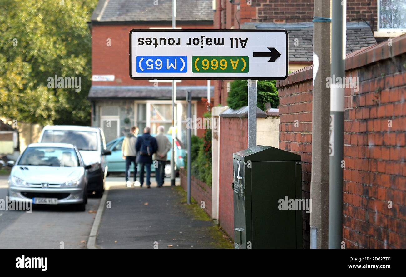General view of a road upside-down road sign outside the ground Stock ...