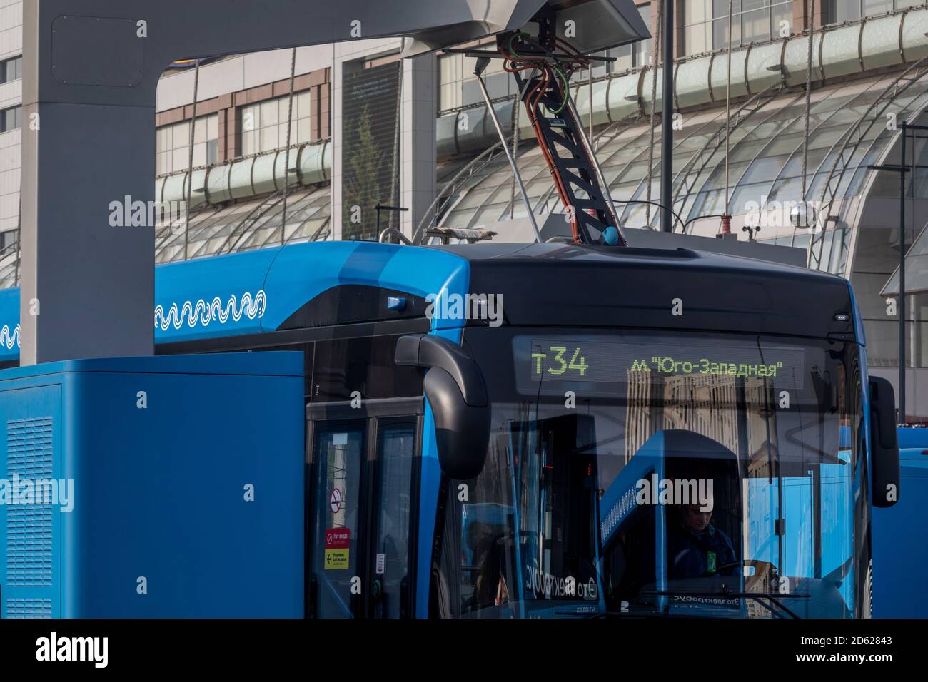 Electric buses stand in line to charge their batteries at the Kievsky ...
