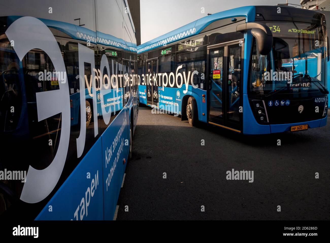 Electric buses stand in line to charge their batteries at the Kievsky ...