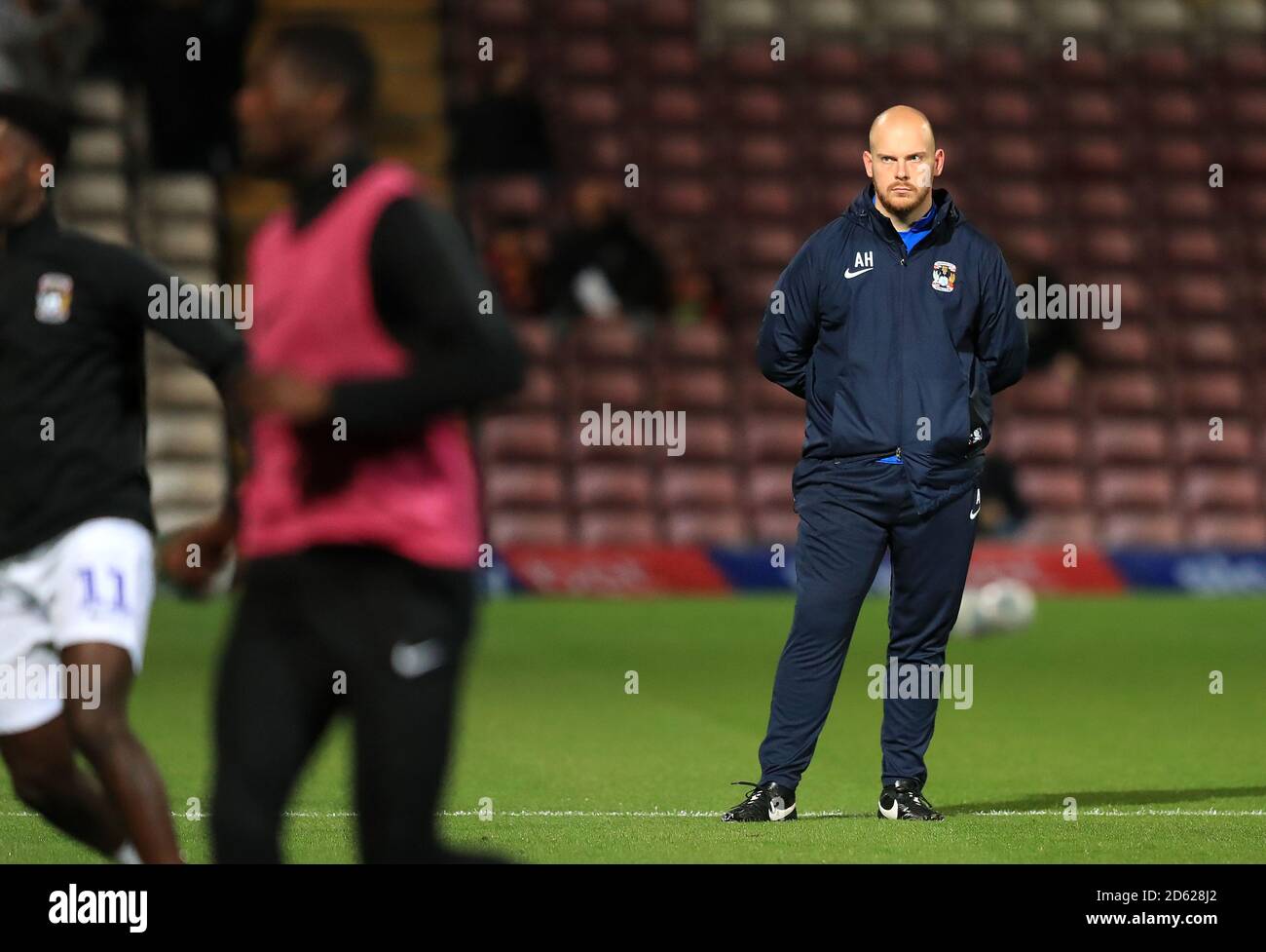 Coventry City physiotherapist Andrew Hemming looks on during the warm ...