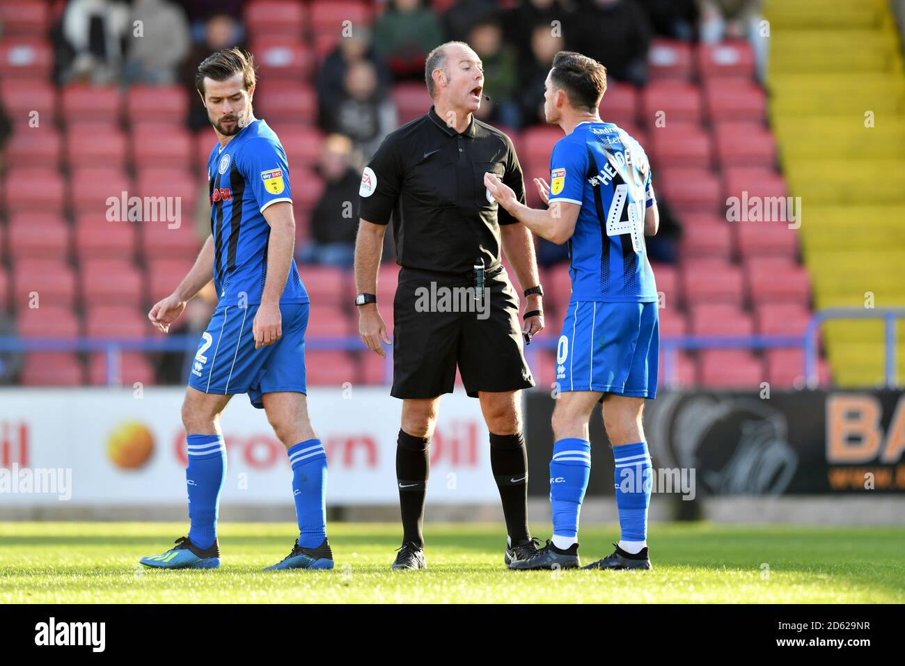 Referee Andy Haines (centre) speaks with Rochdale's Ian Henderson Stock ...
