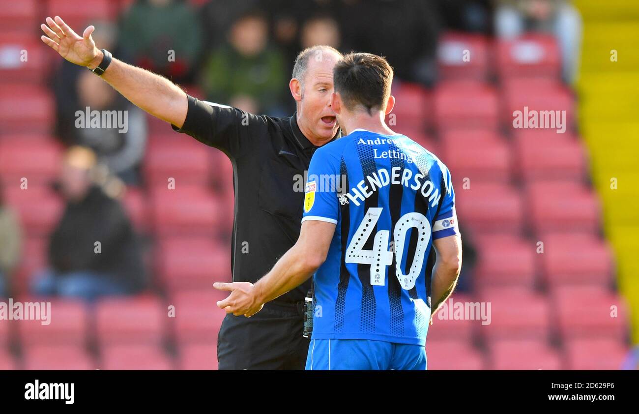 Referee Andy Haines speaks with Rochdale's Ian Henderson Stock Photo ...