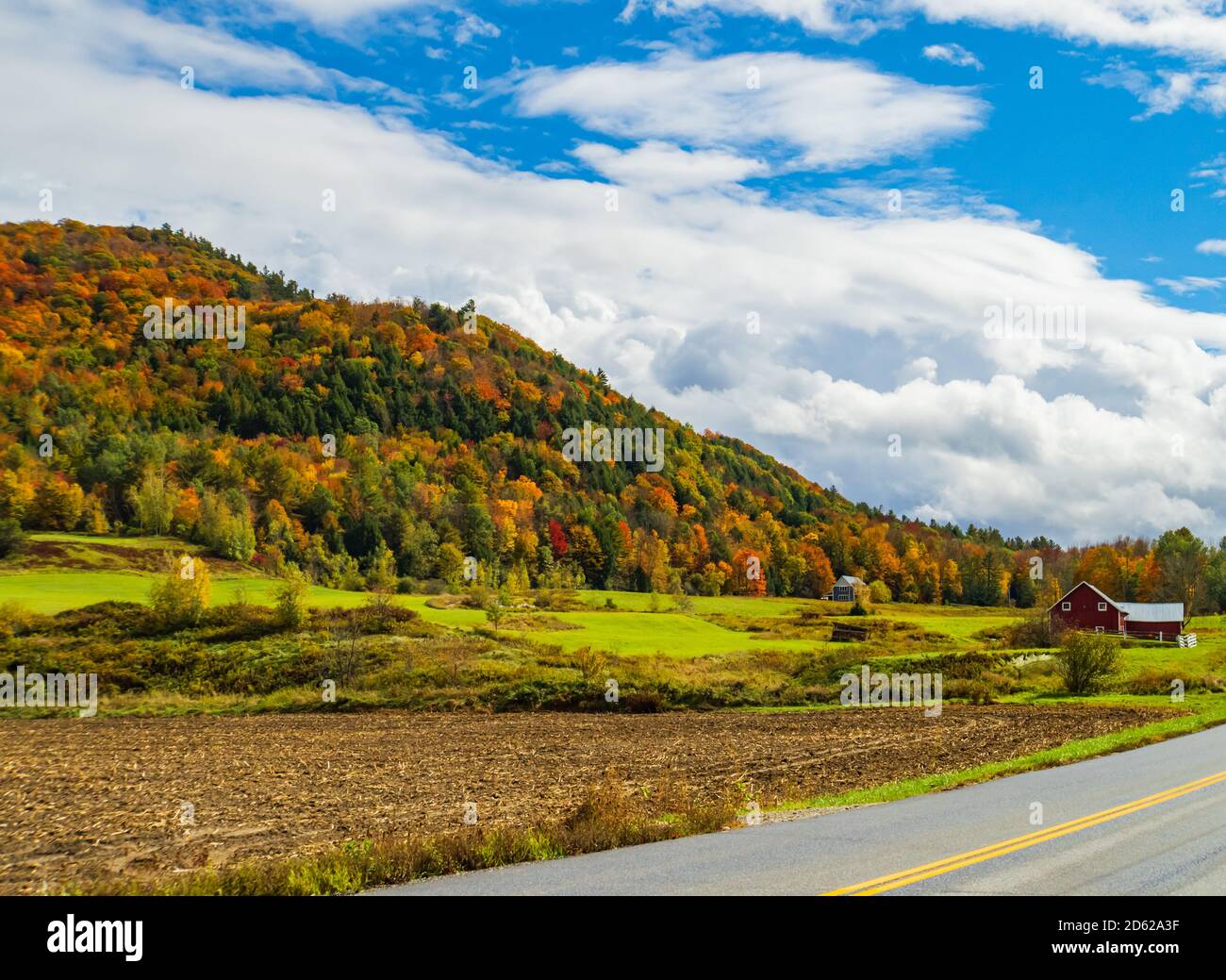 drive along country fields, farms and hills covered in bright fall ...