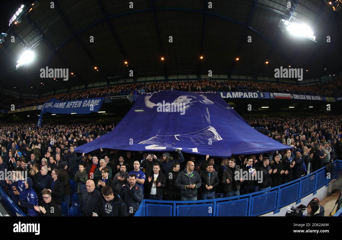 Chelsea fans in the stands hold up a banner fluttering former player ...