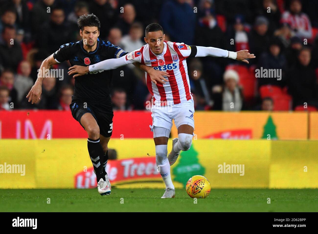 Stoke City's Tom Ince and Middlesbrough's George Friend compete for ...
