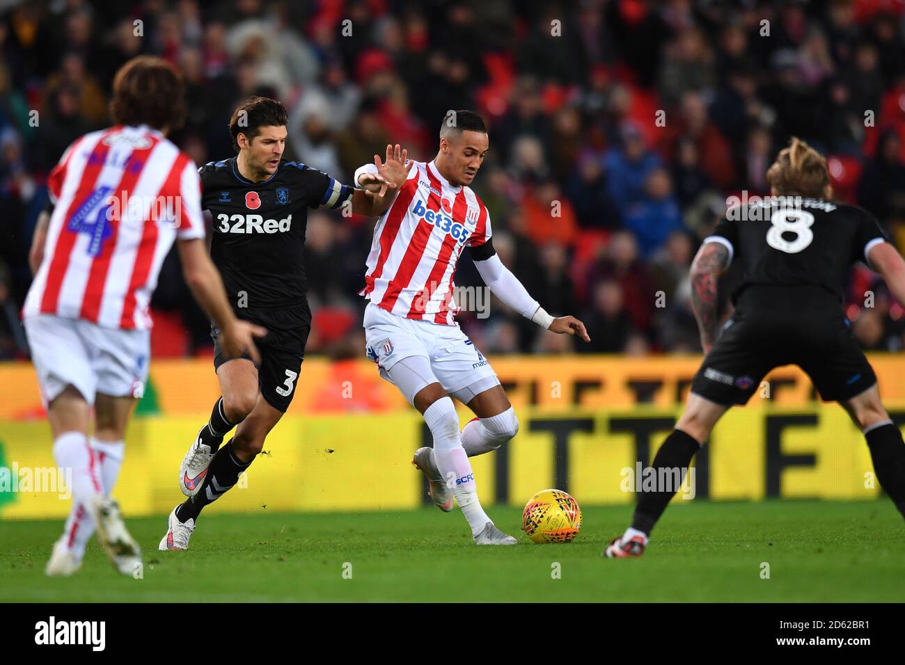Stoke City's Tom Ince and Middlesbrough's George Friend compete for ...