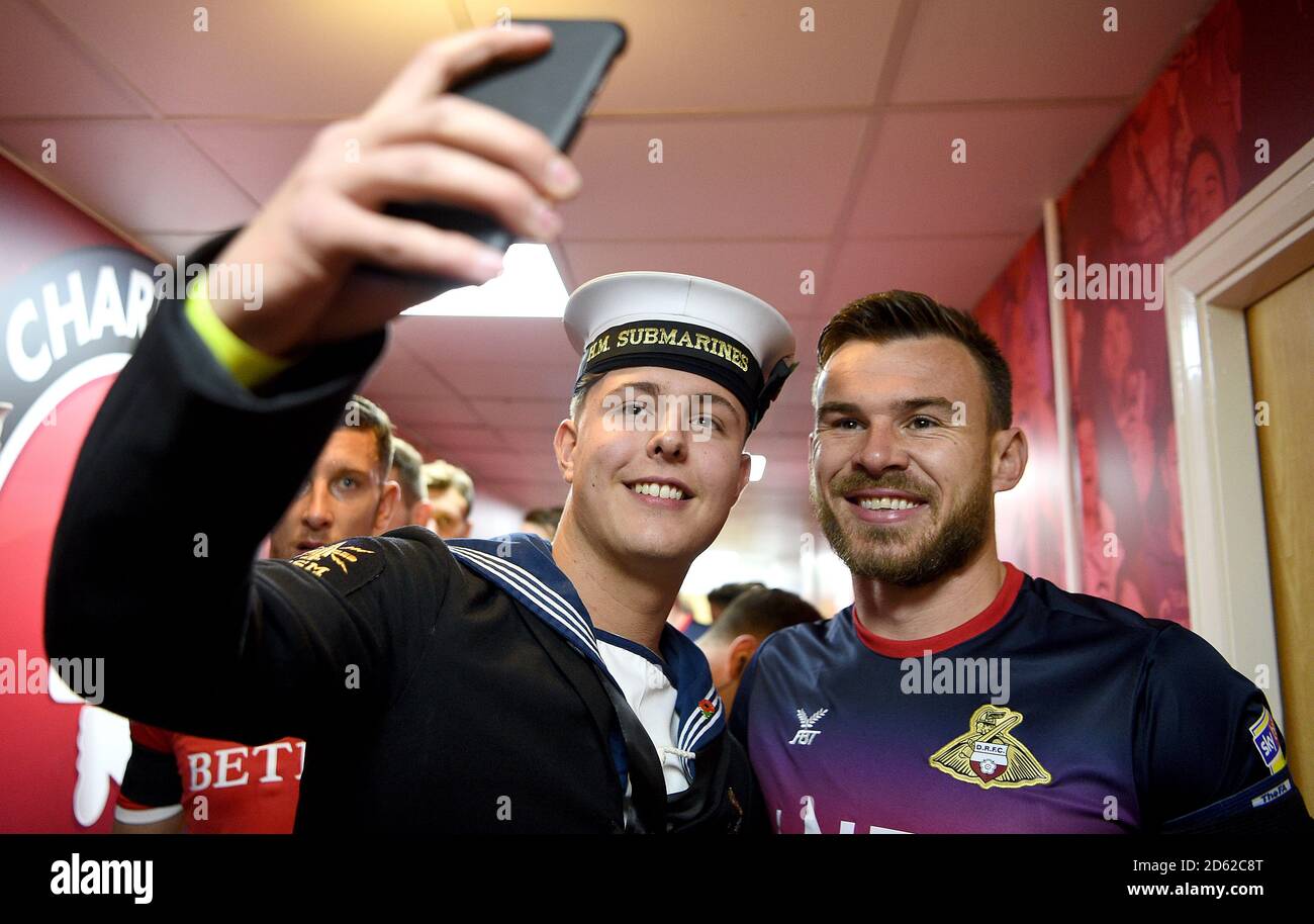 Sub mariners poses with Doncaster Rovers' Andy Butler in the player's ...