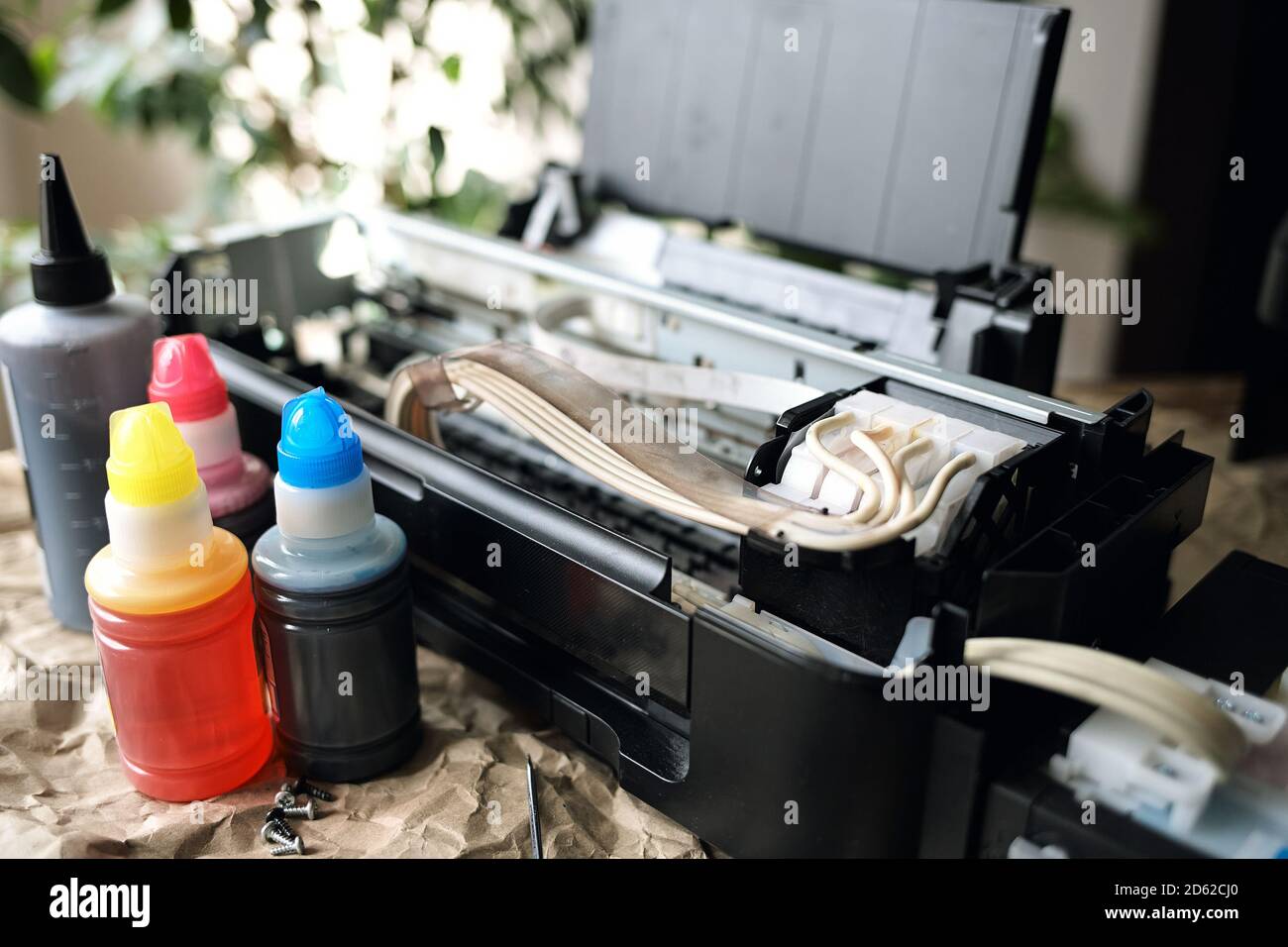 Refilling printer cartridges with multi-colored ink. Background Stock ...