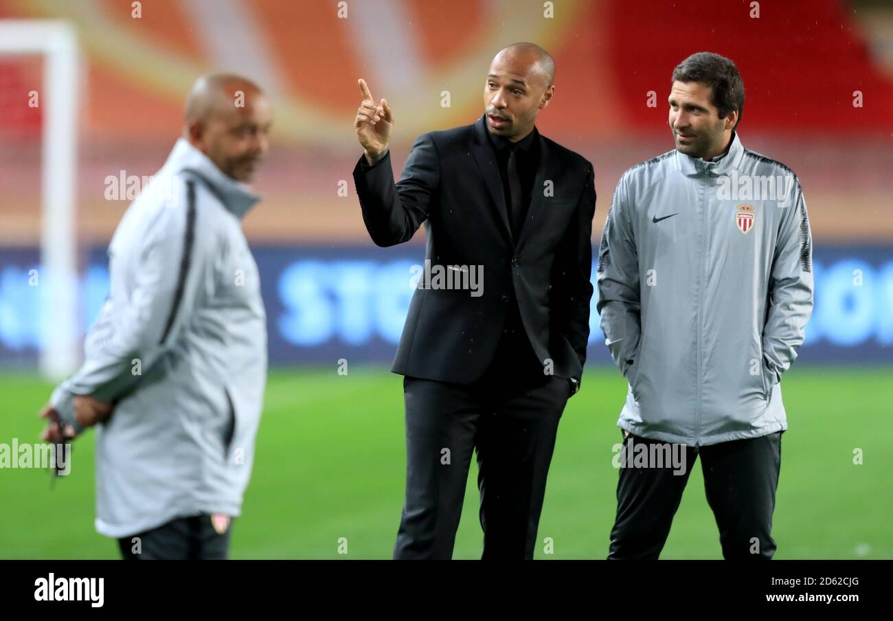 AS Monaco's Manager Thierry Henry (centre) inspects the pitch before ...