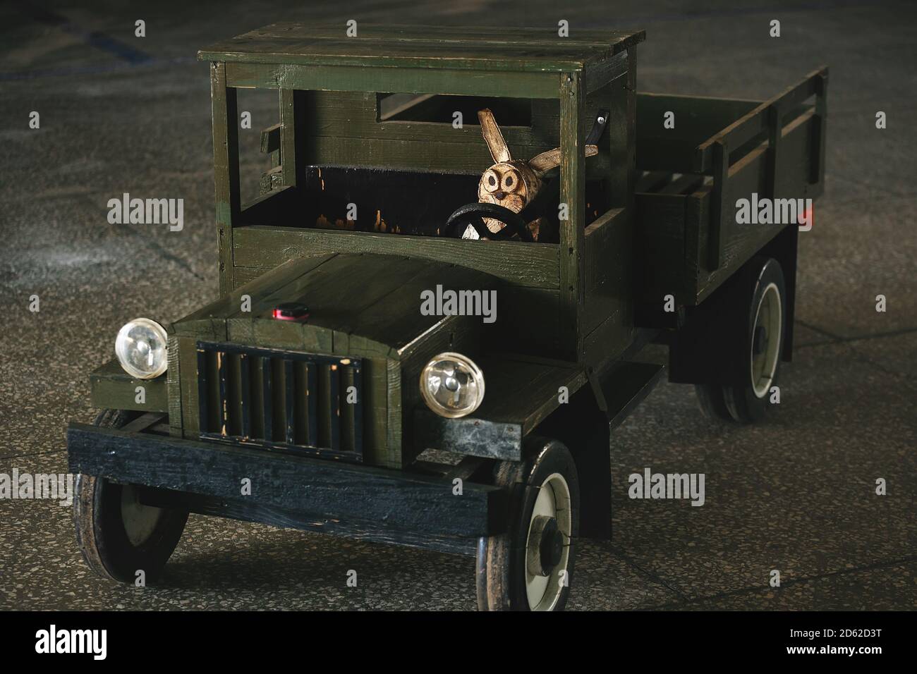 Alert and attentive driver behind the wheel of a wooden truck Stock ...