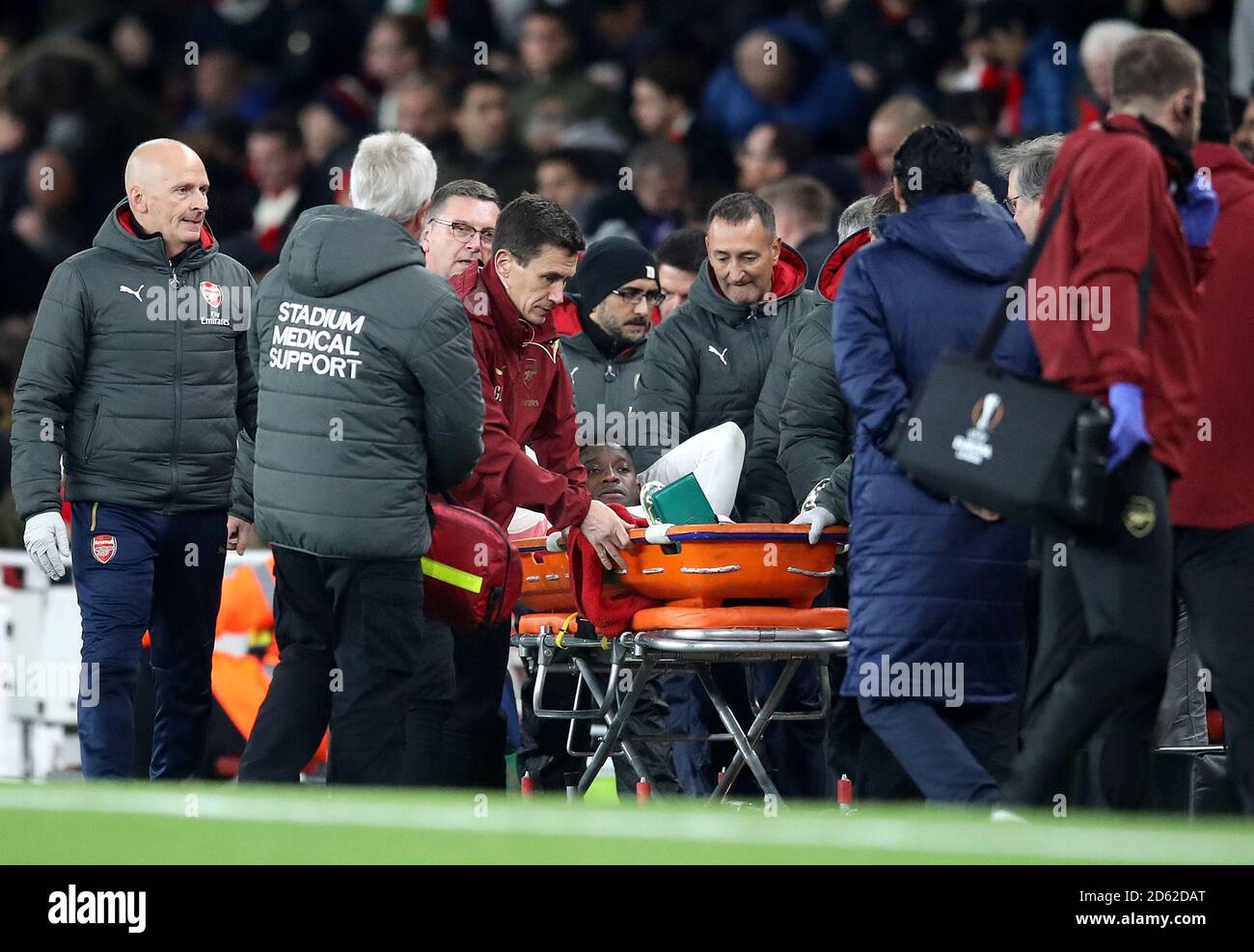 Arsenal's Danny Welbeck is carried off the pitch on a stretcher after ...