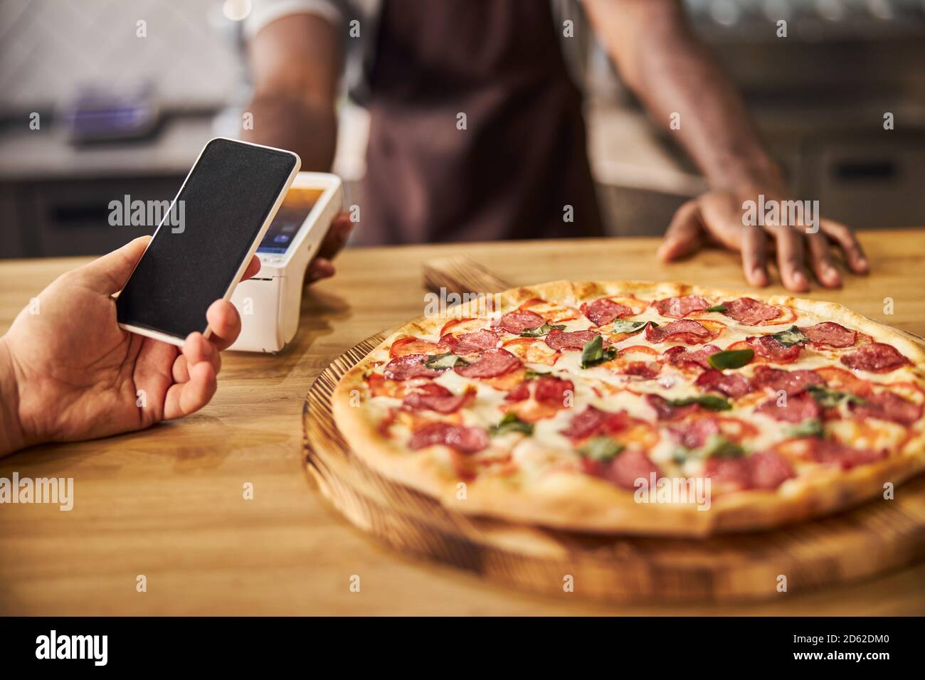 Man buy pizza hi-res stock photography and images - Alamy