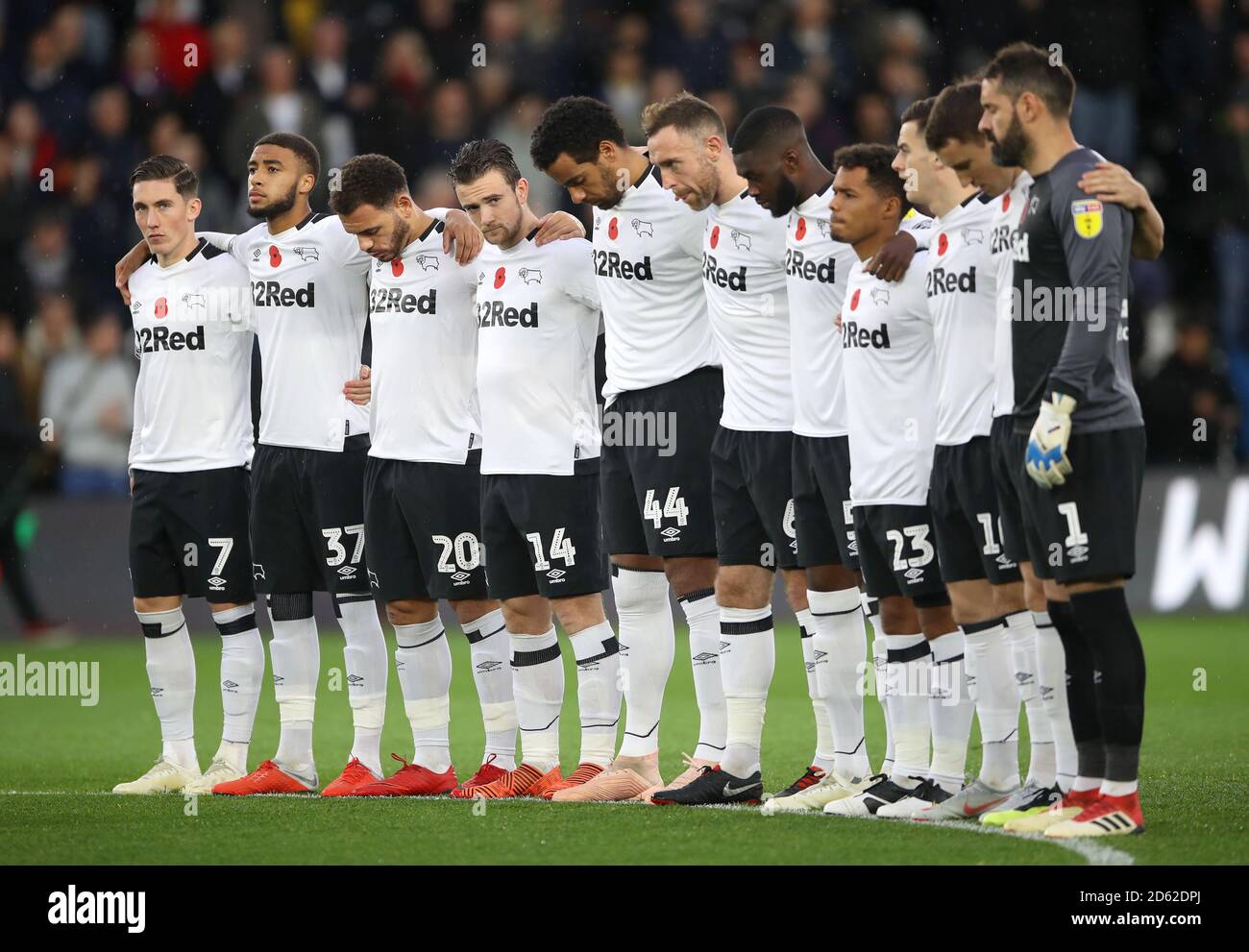 Derby County players stand for a minutes silence for Armistice day ...