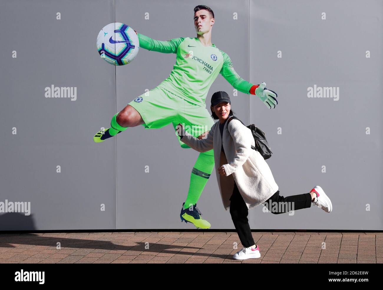 A fan poses by a mural Stock Photo - Alamy