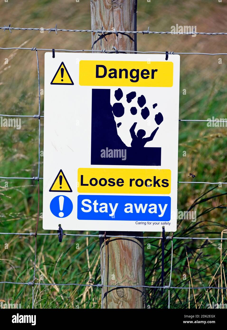 Warning sign. "Danger Loose rocks Stay away!". Roan Edge Quarry, Cemex ...