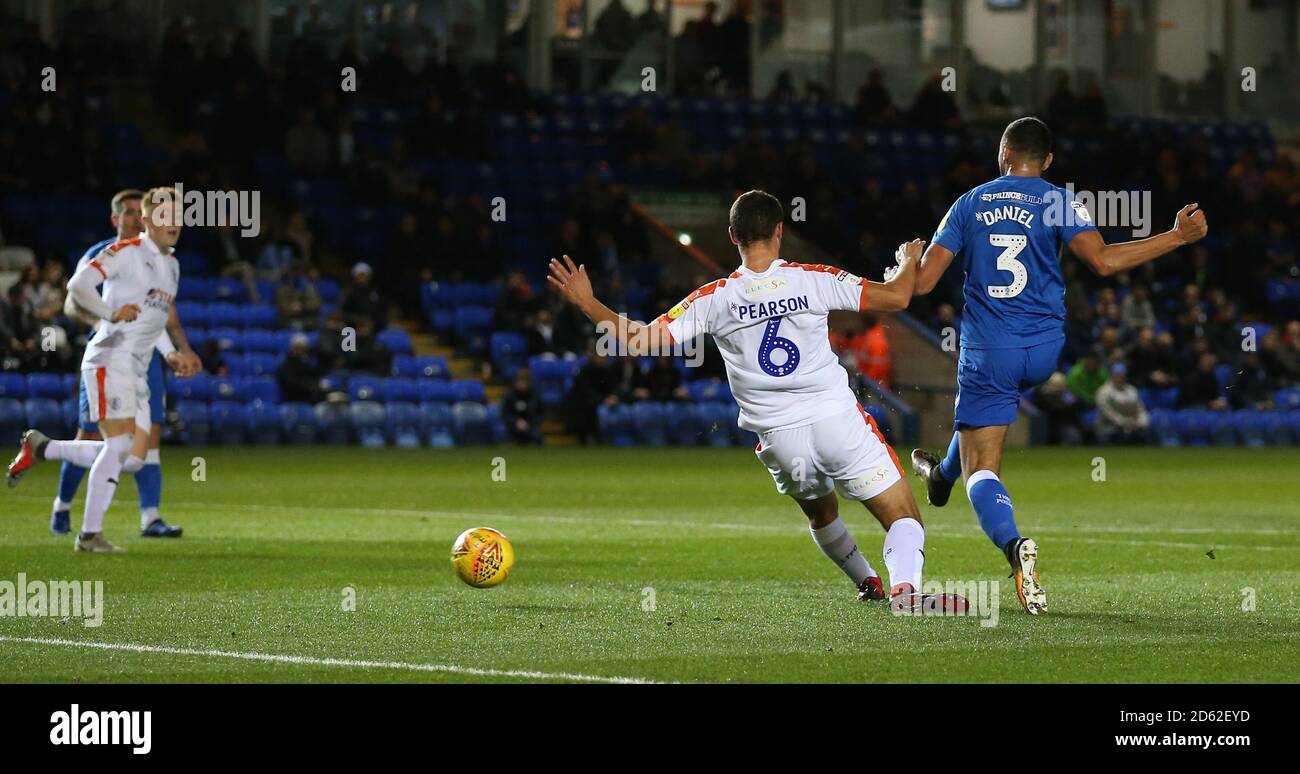 Peterborough United's Colin Daniel (right) scores his side's first goal ...