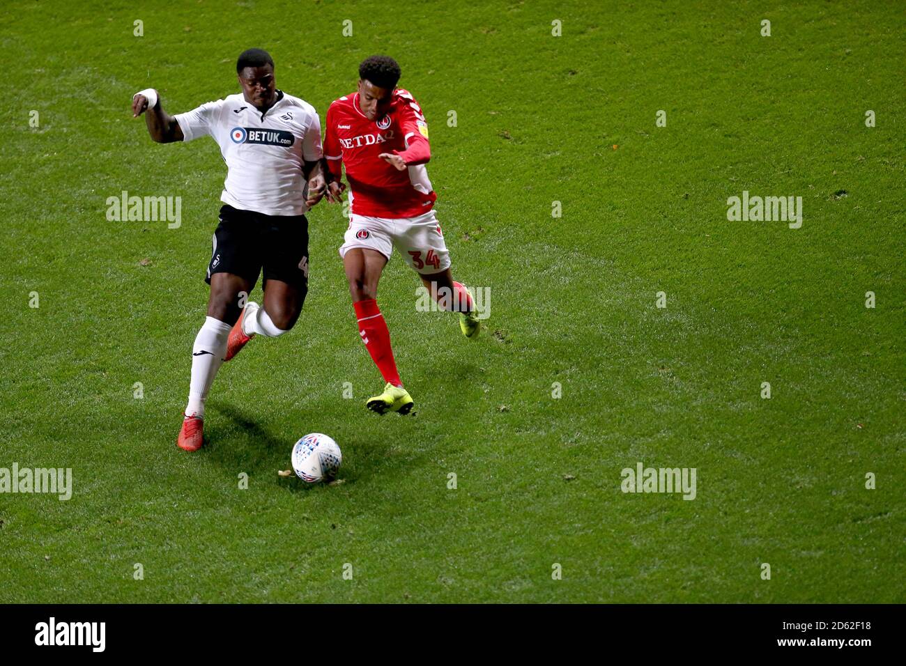 Swansea City's Tyler Reid (left) and Charlton Athletic's Jamie Mascoll ...