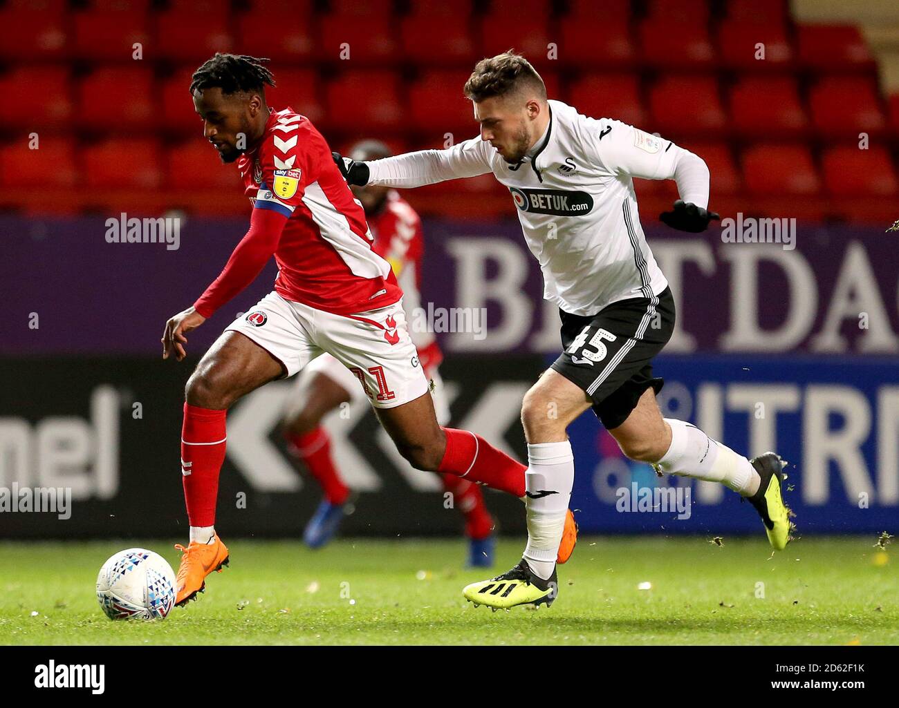 Swansea City's Thomas Price (right) and Charlton Athletic's Tariqe Fosu ...