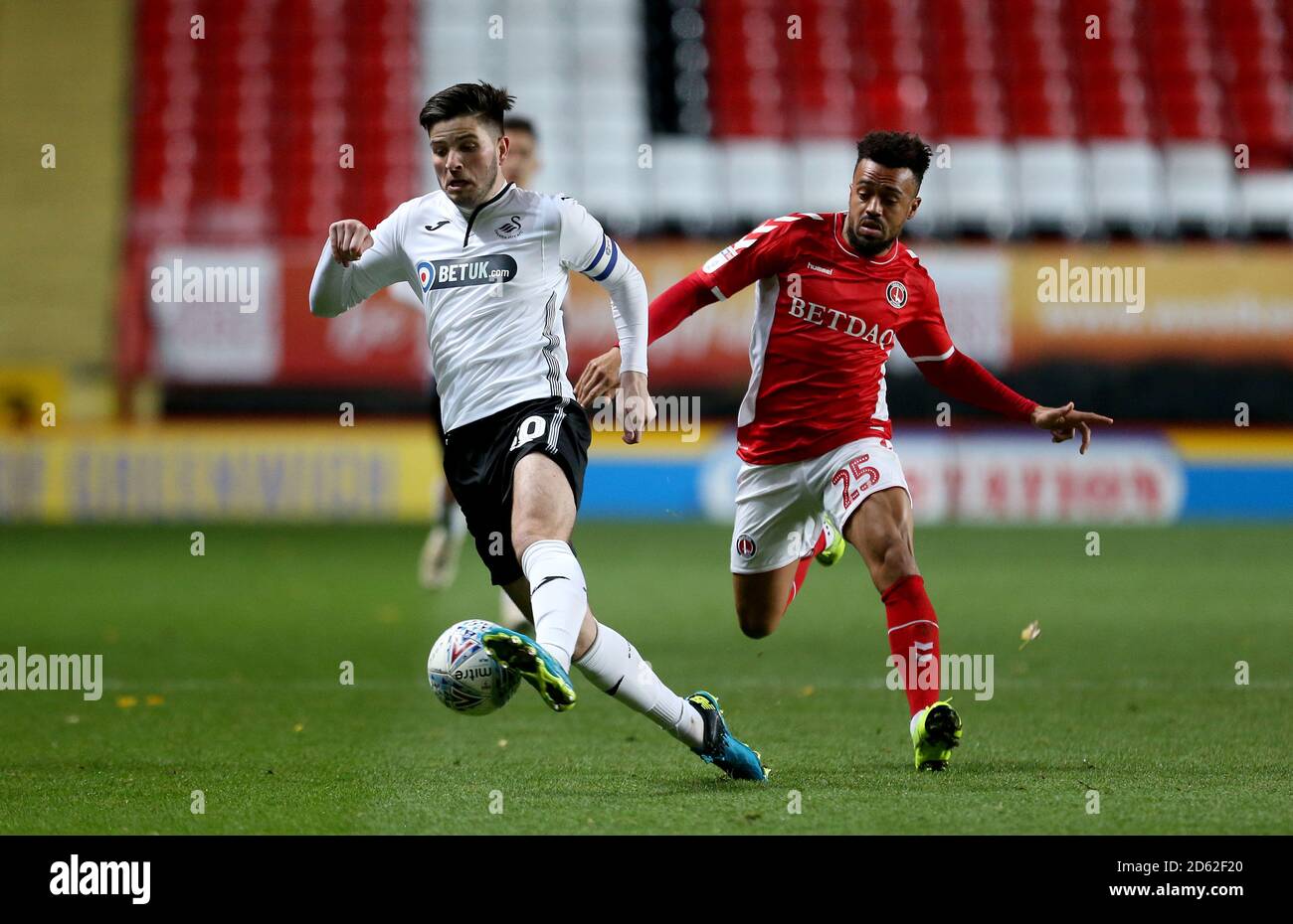Swansea City's Cian Harries (left) and Charlton Athletic's Nicky Ajose ...