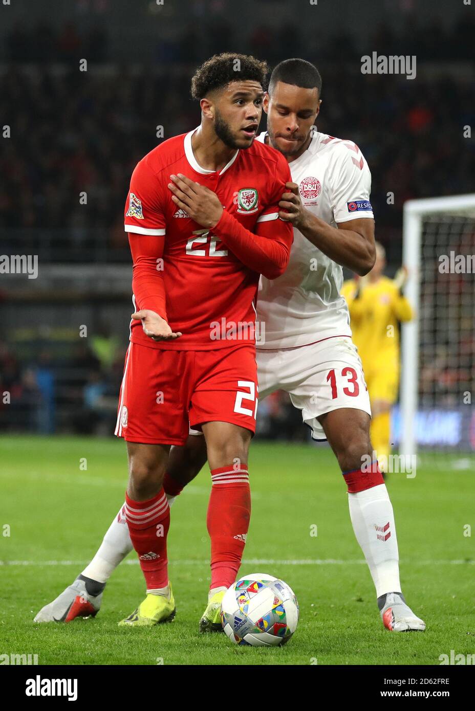 Wales' Tyler Roberts (left) and Denmark's Mathias Jorgensen argue after ...