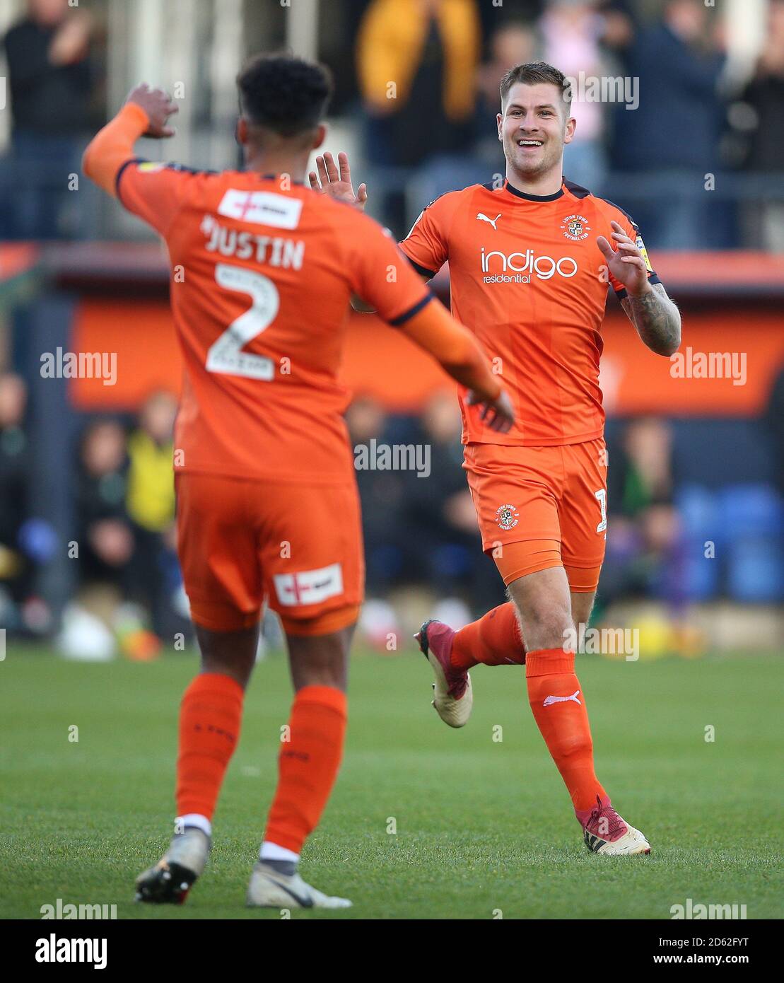 Luton Town's James Collins (facing) celebrates scoring his sides first ...