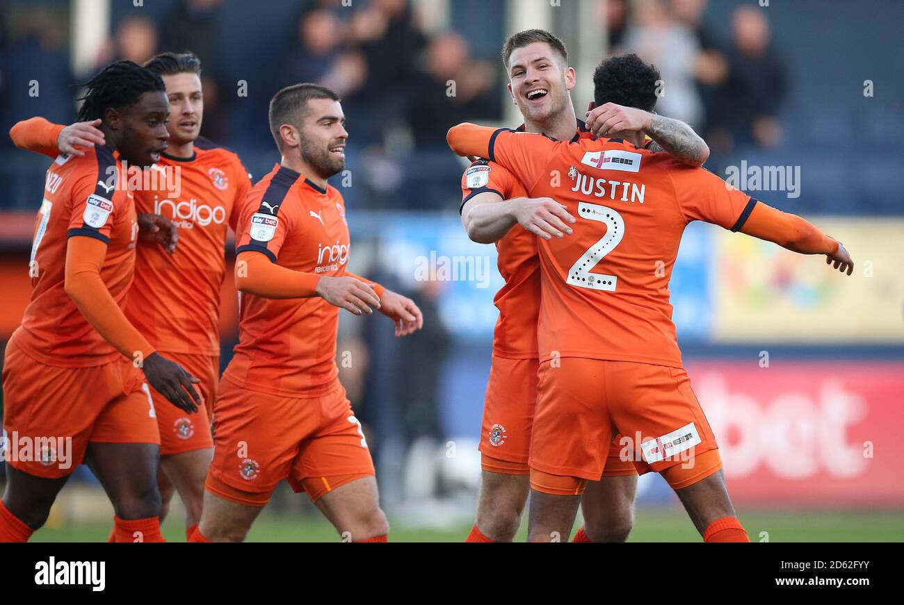 Luton Town's James Collins (facing) celebrates scoring his sides first ...