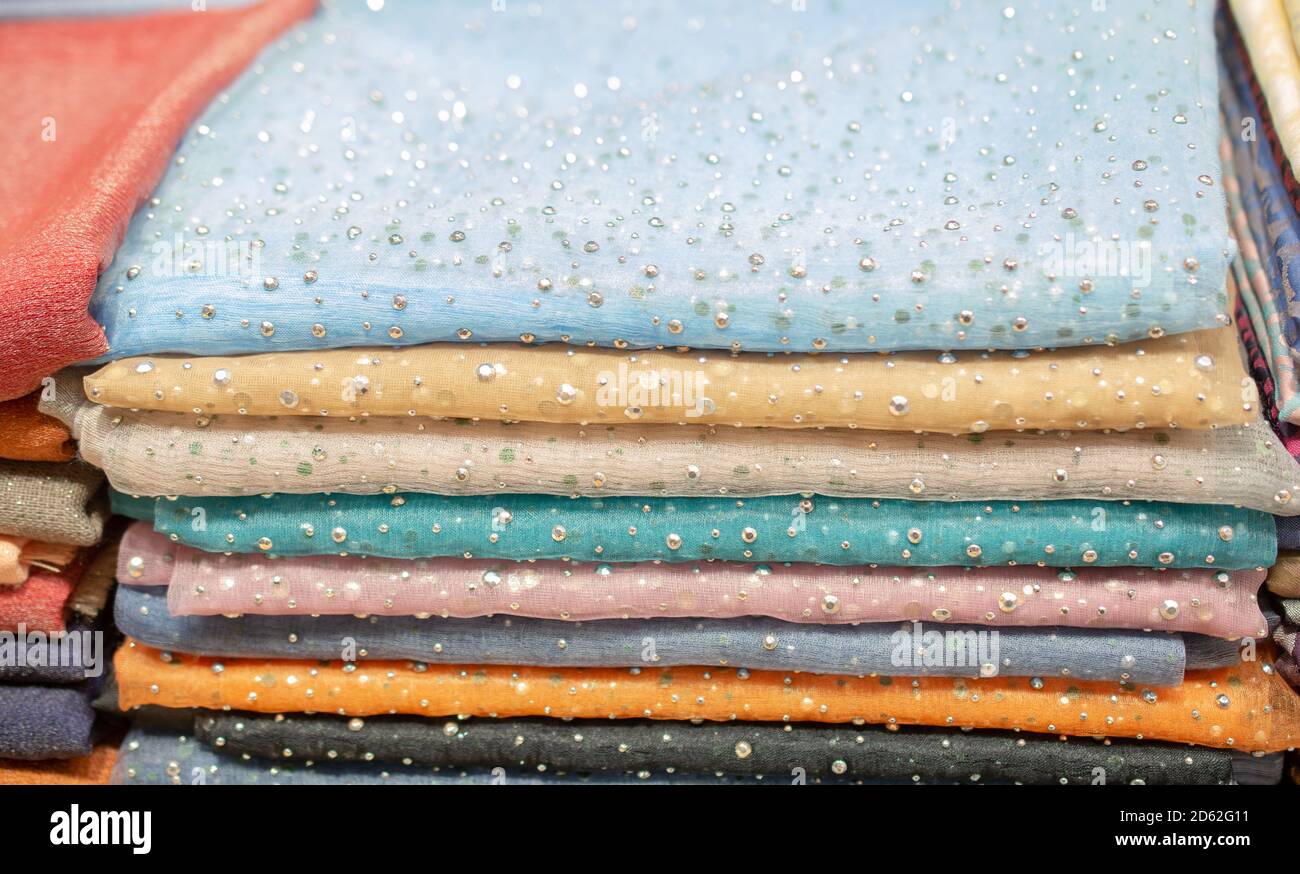 Pile of bright Multi-colored pieces of fabric in a bazaar Stock Photo ...