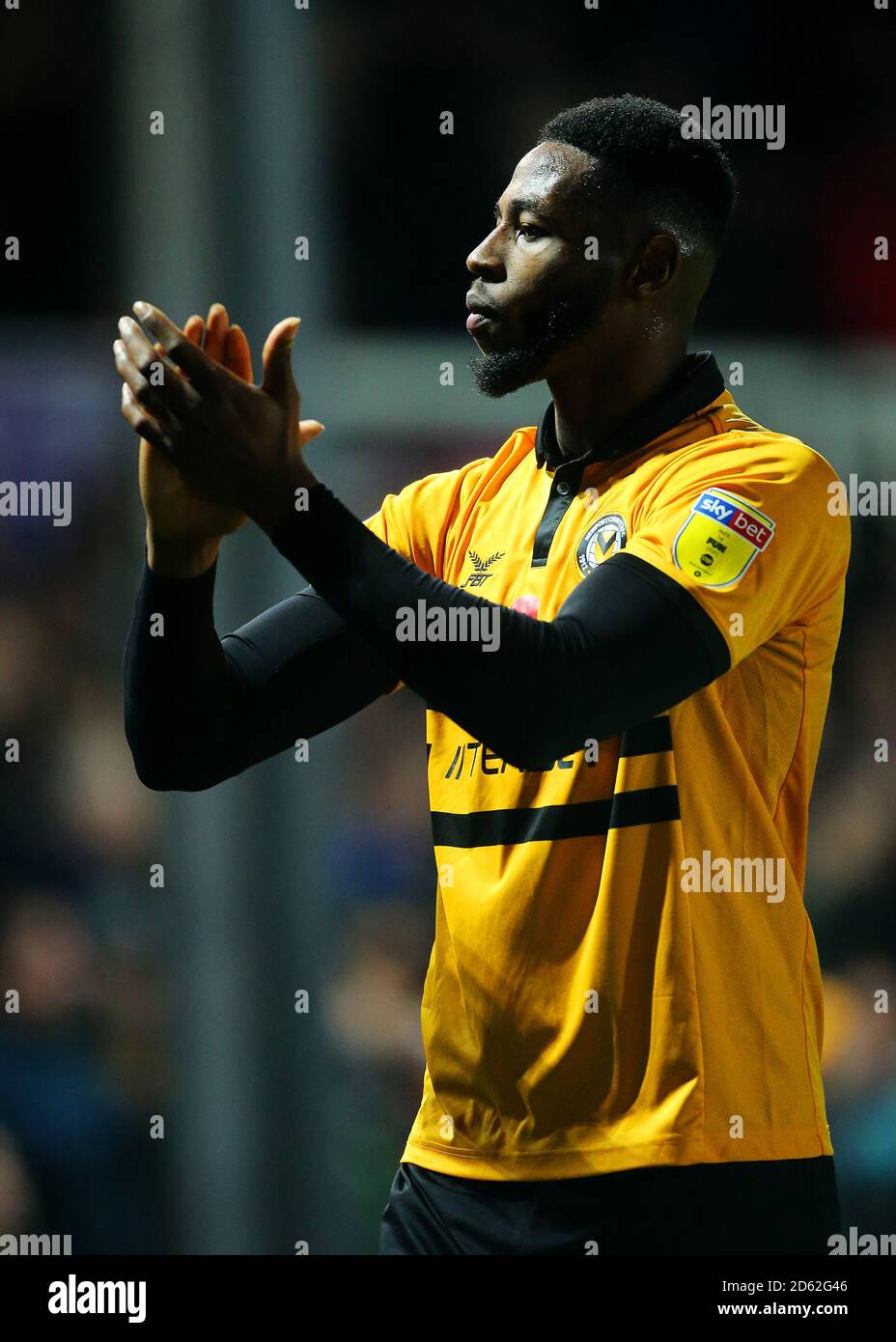 Newport County's Jamille Matt applauds fans at full time Stock Photo ...