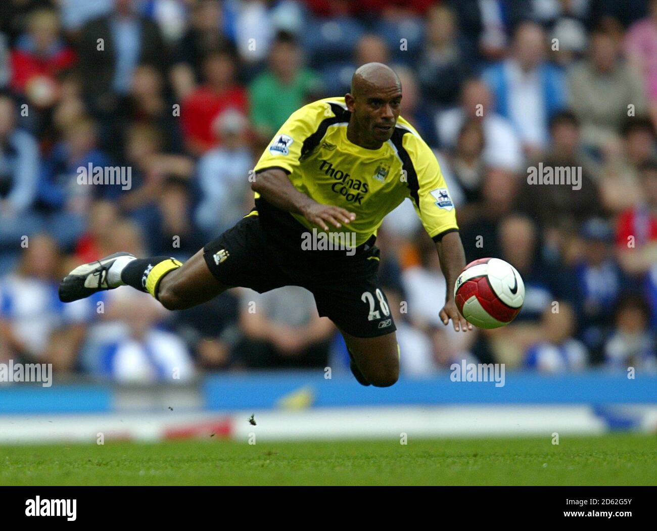 Manchester City's Trevor Sinclair goes to ground after being fouled ...