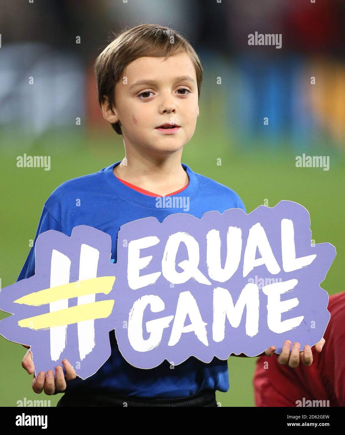 A mascot holds up an equal game sign Stock Photo - Alamy