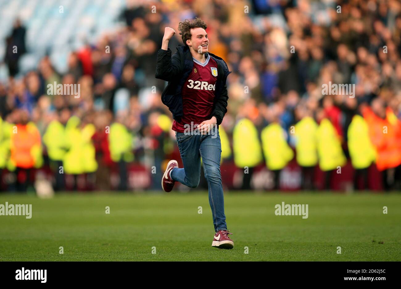 A pitch invader runs onto the pitch Stock Photo - Alamy